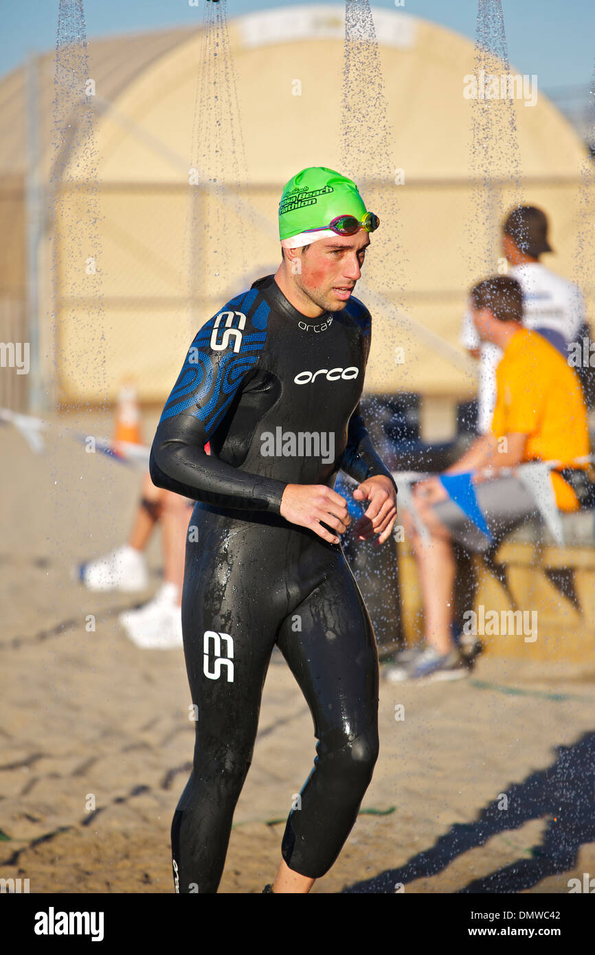 Male Swimmer Approaching The Finish Line At The Hermosa Beach Triathlon ...