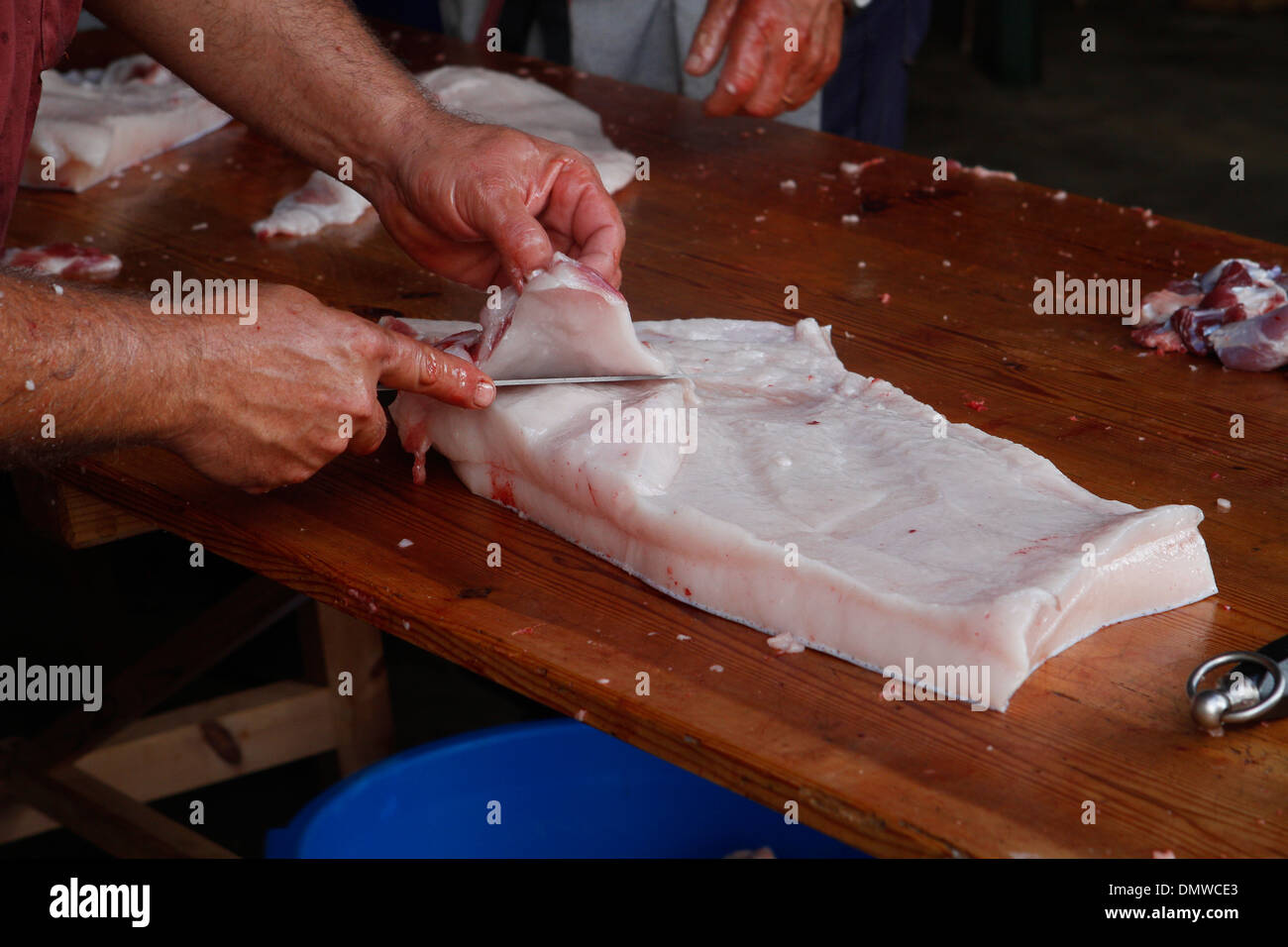 Different process during a traditional local pig slaughter in the ...