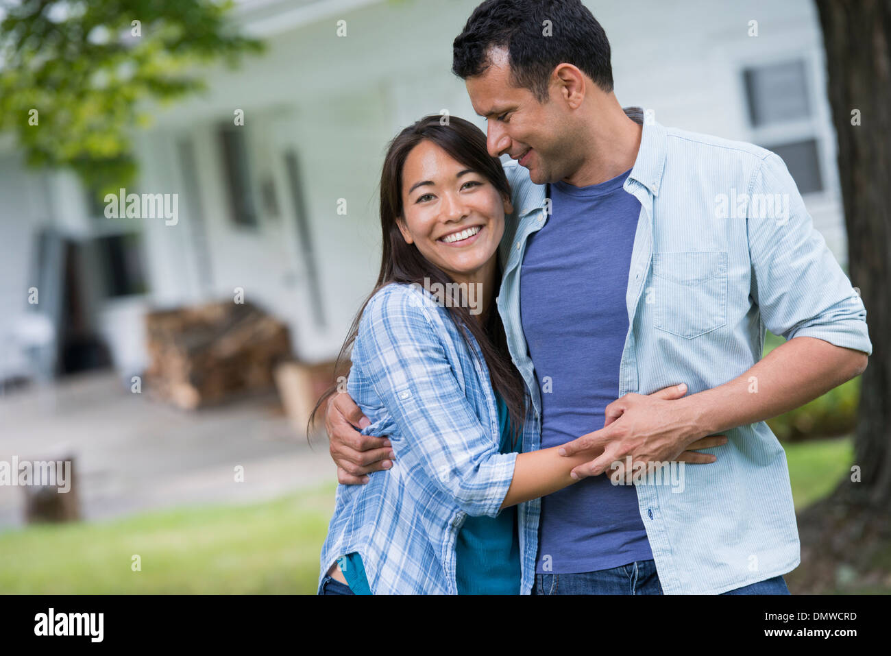 A couple with arms around each or Stock Photo - Alamy