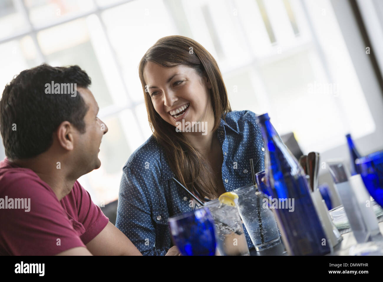 A couple sits at a table hi-res stock photography and images - Alamy