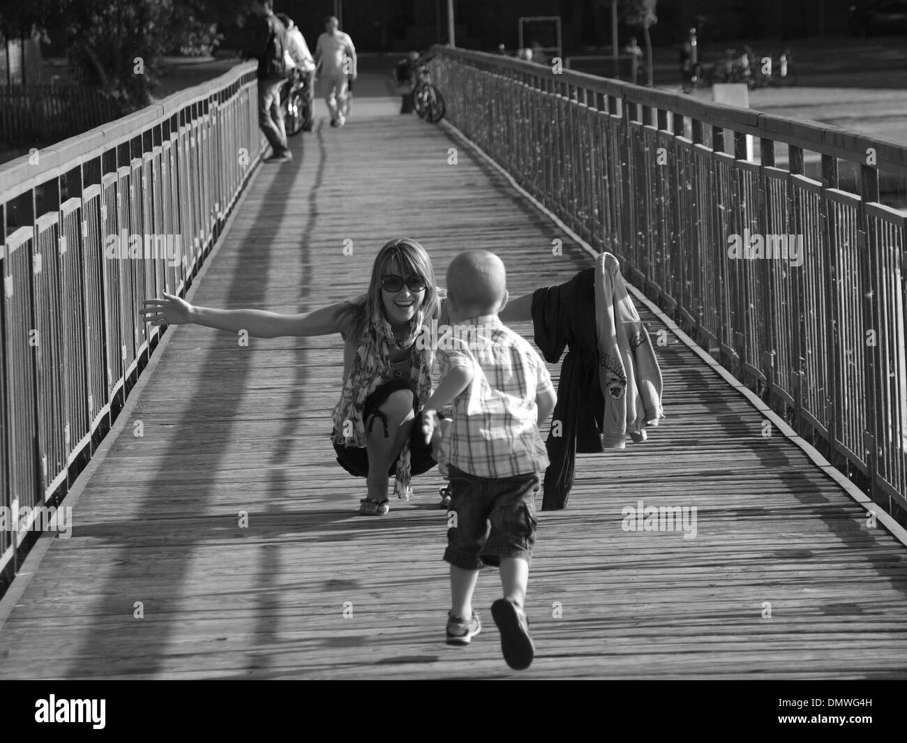 Boy running toward his mother Stock Photo - Alamy