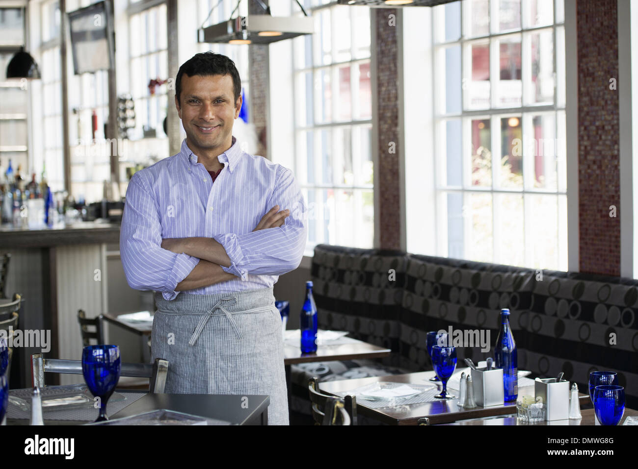 A cafe interior. A man in chef's whites Stock Photo - Alamy