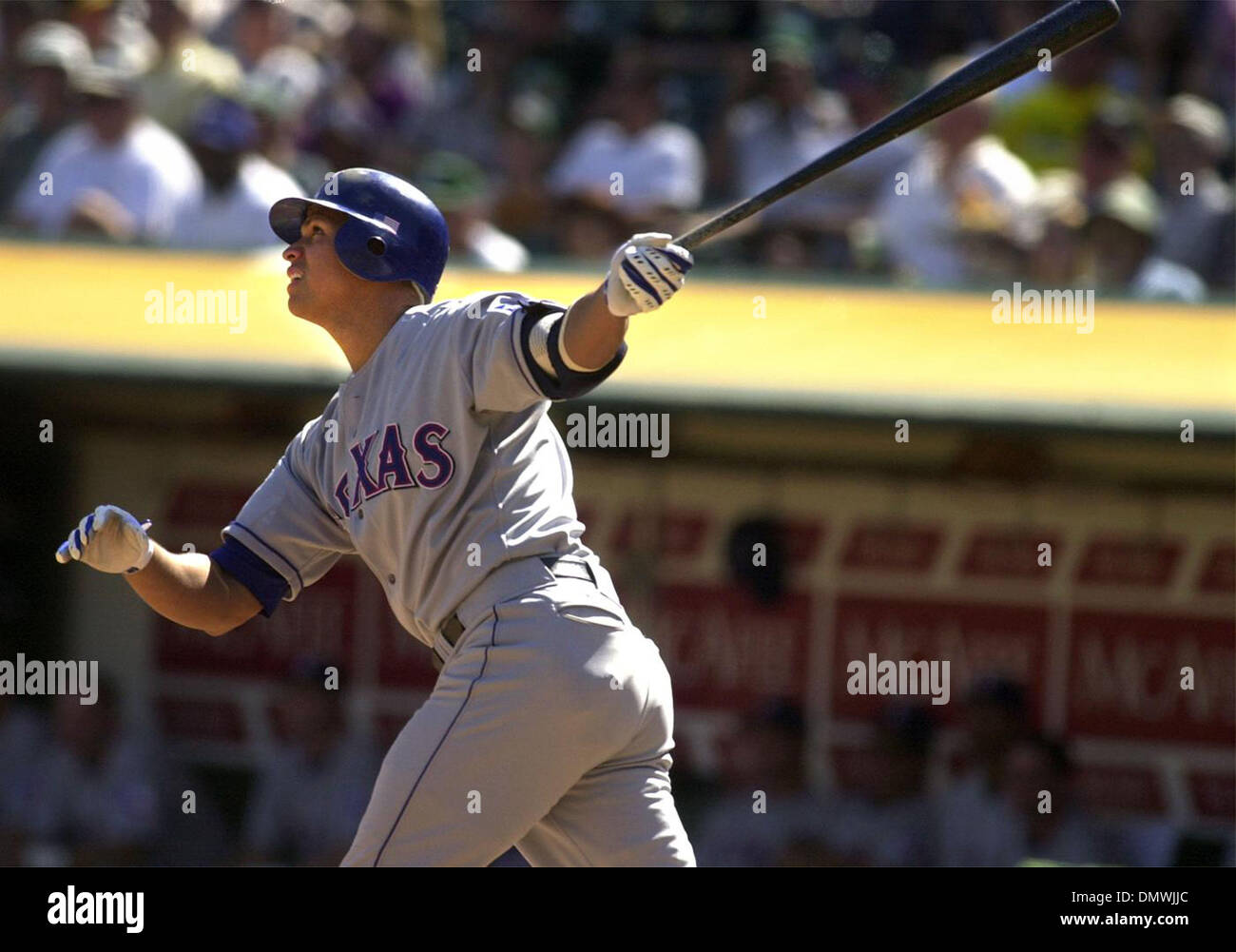 Sep 25, 2001; Berkeley, CA, USA; Alex Rodriguez follows the flight of ...