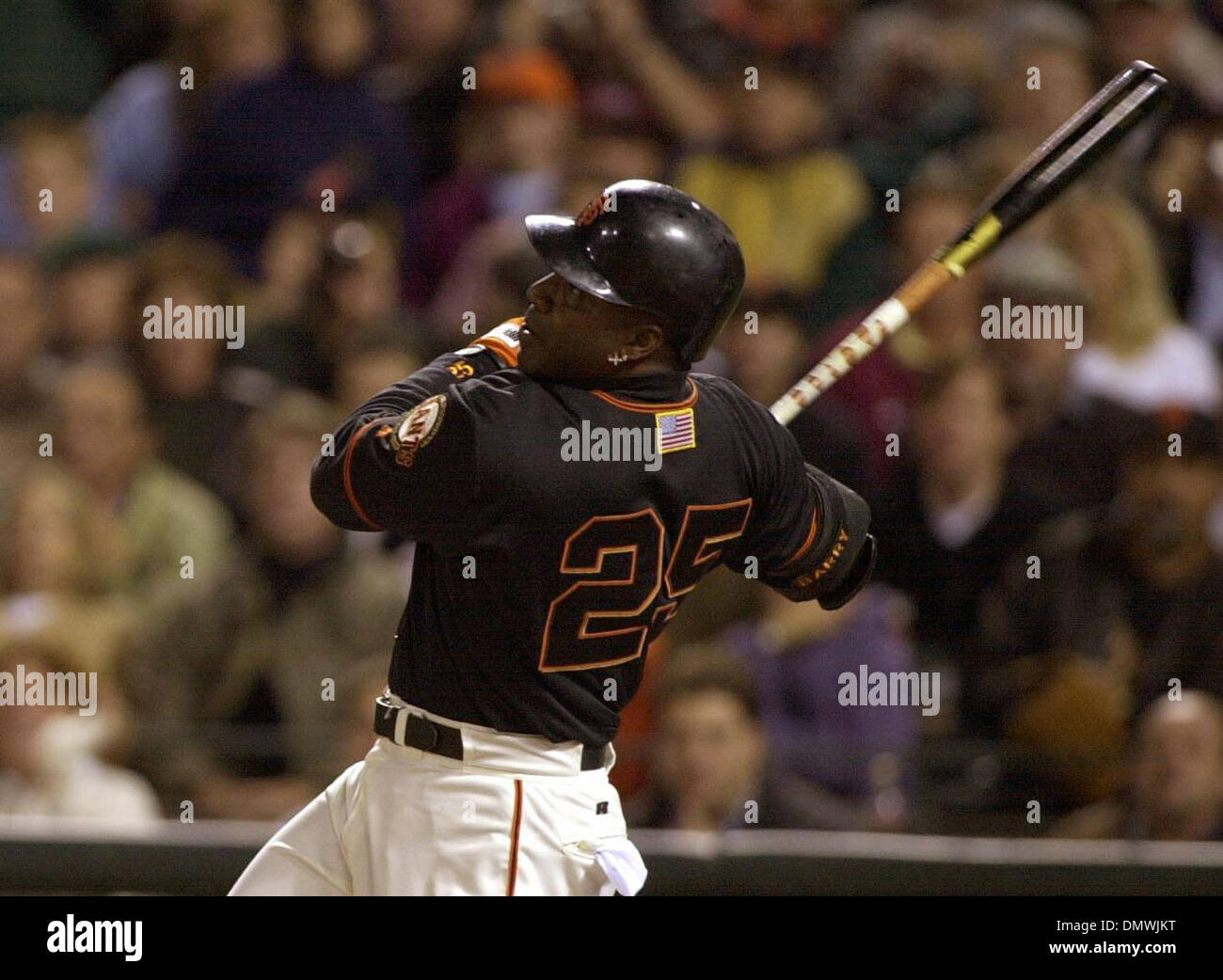 Oct 05, 2001; San Francisco, CA, USA; Giants Barry Bonds follows the flight of number 71 in the ...