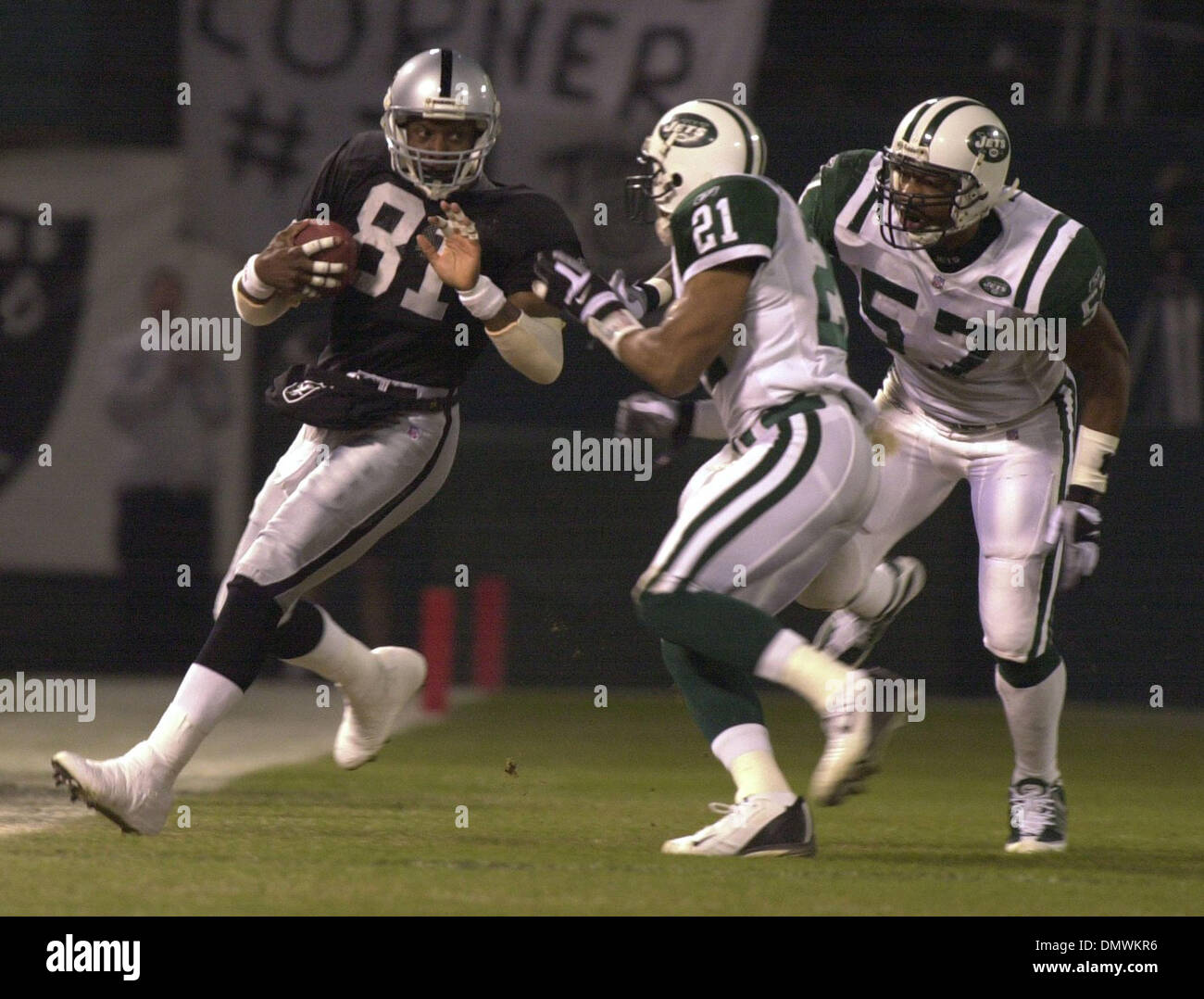 Jan 19, 2002; Foxboro, MA, USA; Raider Tim Brown, 81, is pursued by ...