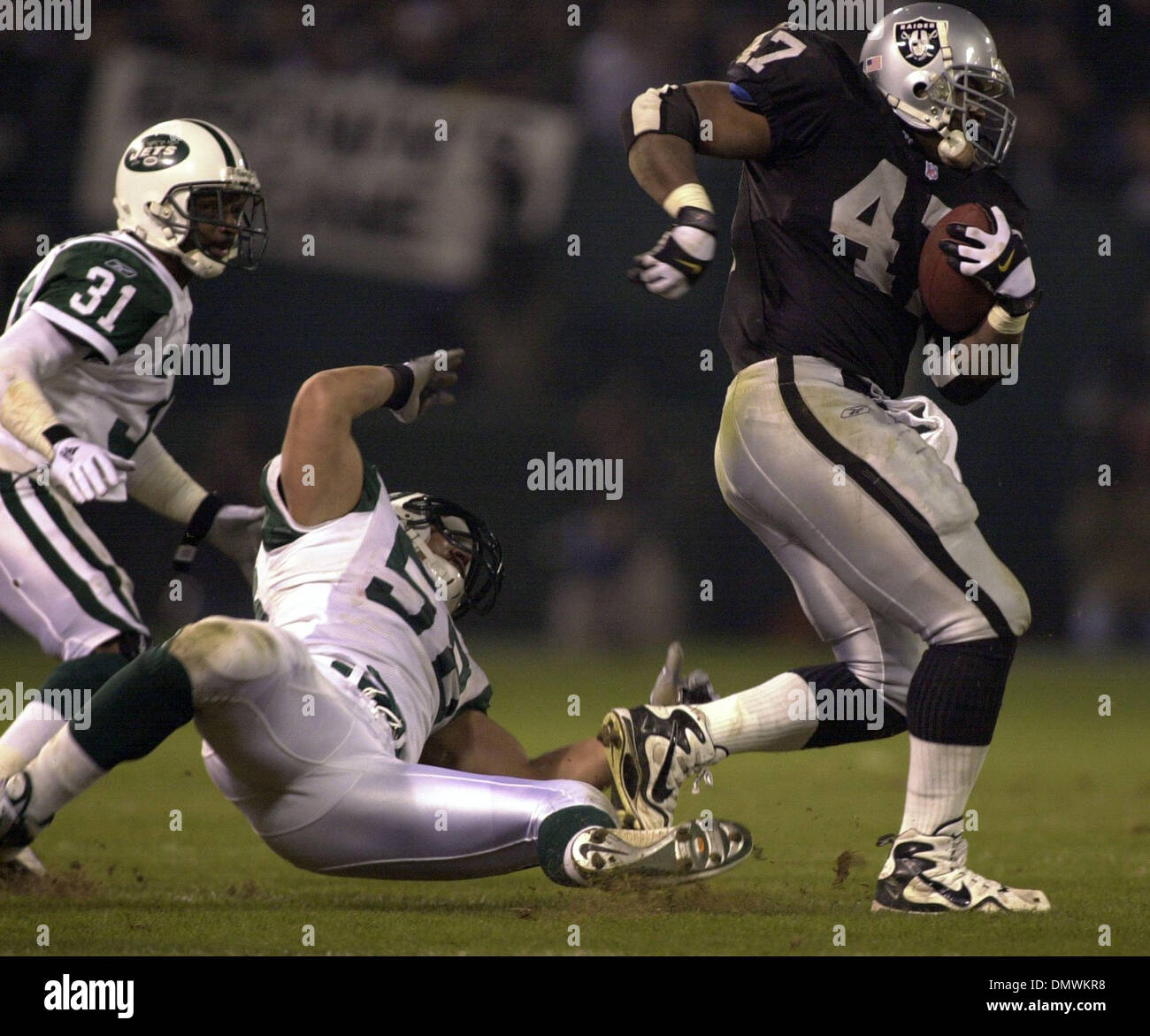 Jan 19, 2002; Foxboro, MA, USA; Raider Tyrone Wheatley, 47, gets by Jet ...