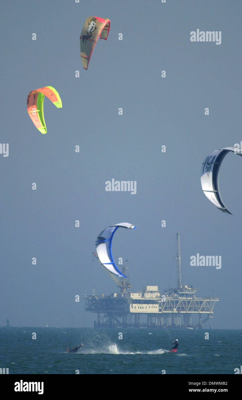 Kite Surfers fill the sky with their kites off Long Beach, with an oil ...