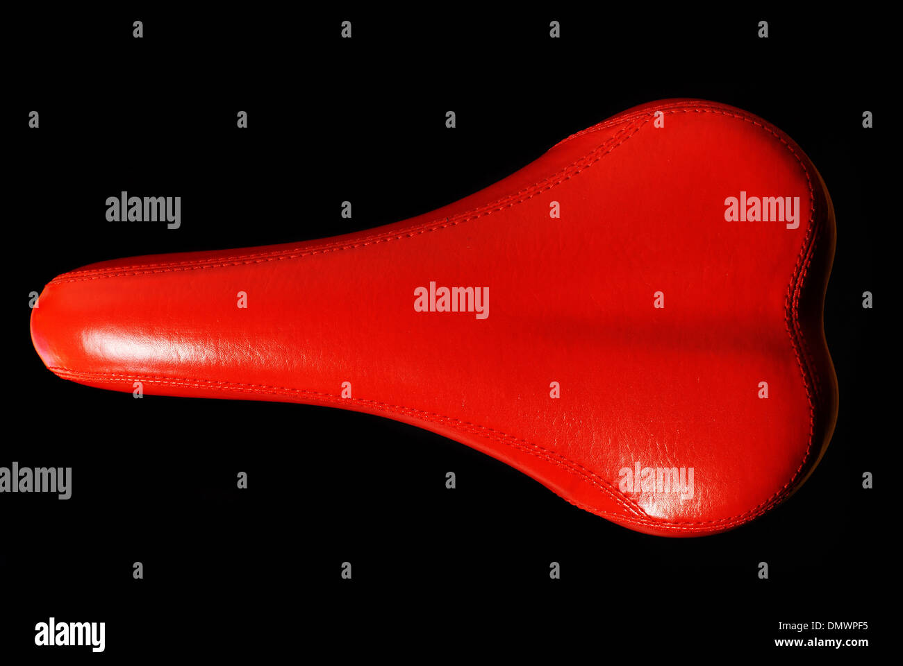 creative red saddle on black background Stock Photo - Alamy