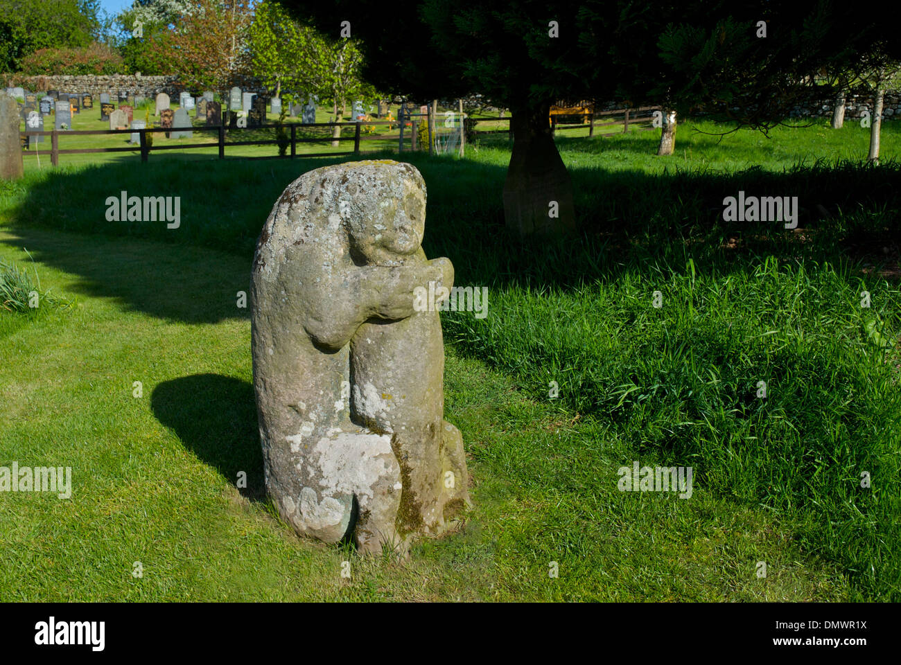 Carved stone bear, one of four in the churchyard of St Andrew's Church ...
