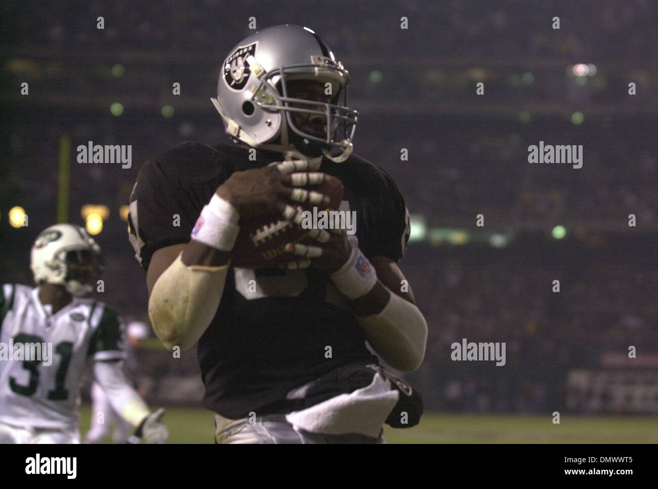 Jan 12, 2002; Oakland, CA, USA; Raider, Tim Brown, 81, pulls in a 2nd ...