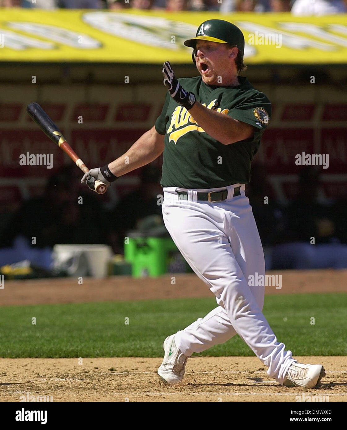 Mar 30, 2002; Oakland, CA, USA; Oakland A's Jeremy Giambi, #7, stumples ...