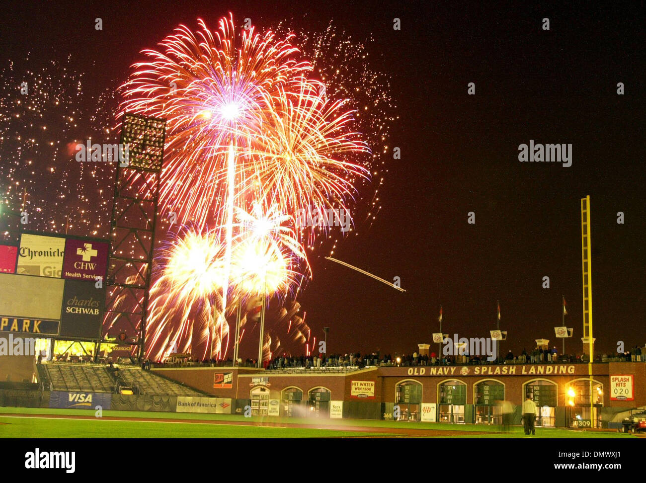 Jun 14, 2002; Oakland, CA, USA; Baseball fans look up at the sky and ...