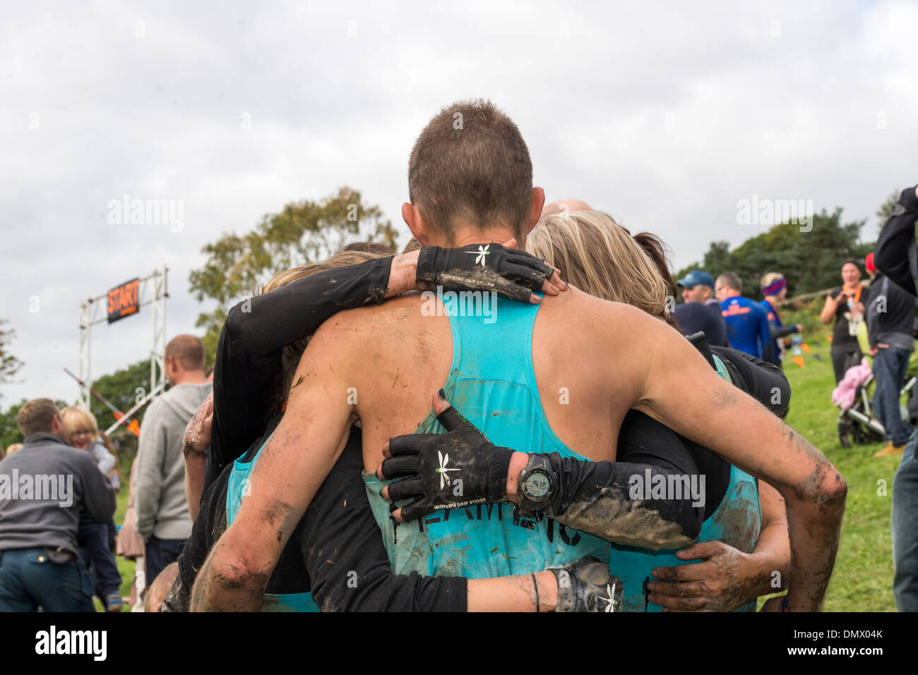 People celebrating with group hug after finishing Endurance race in ...