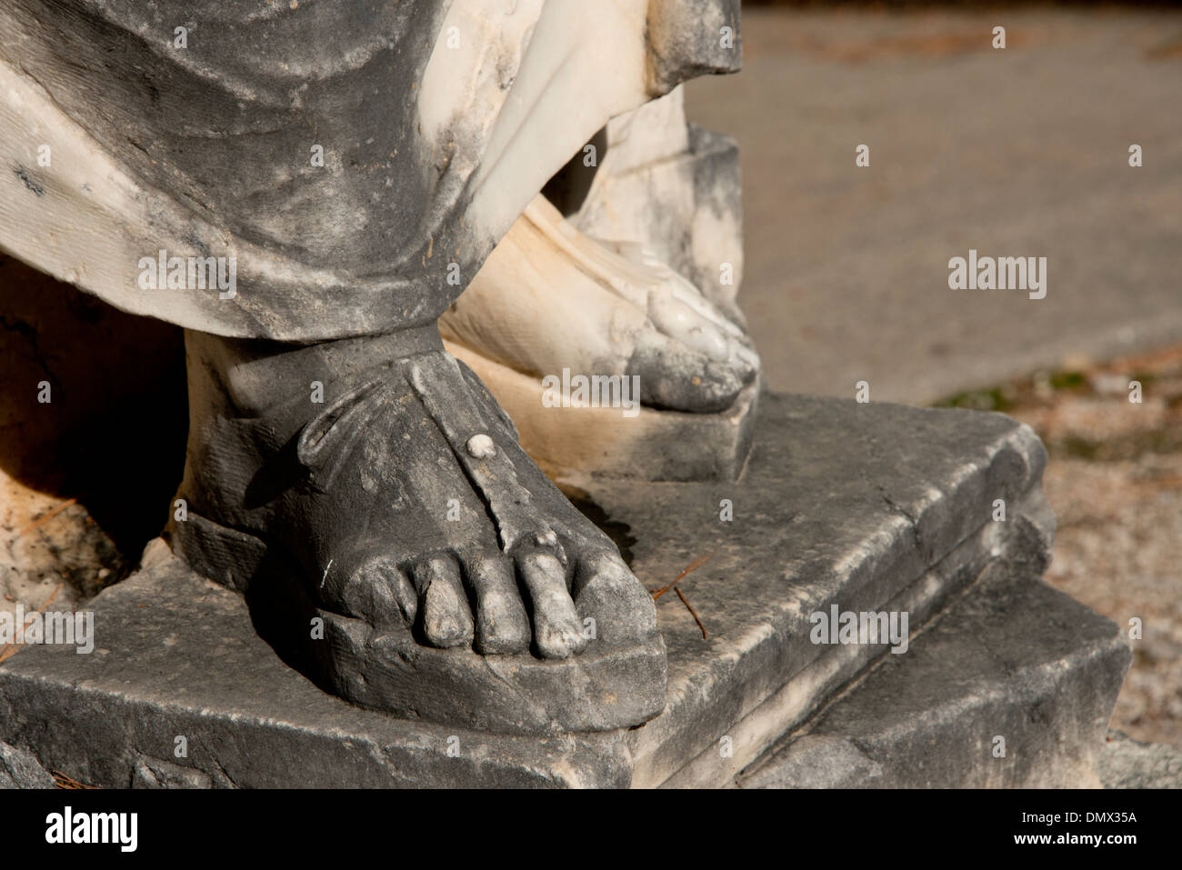 Greece, Corinth, Ancient Corinth. Carved marble statue, detail of feet ...