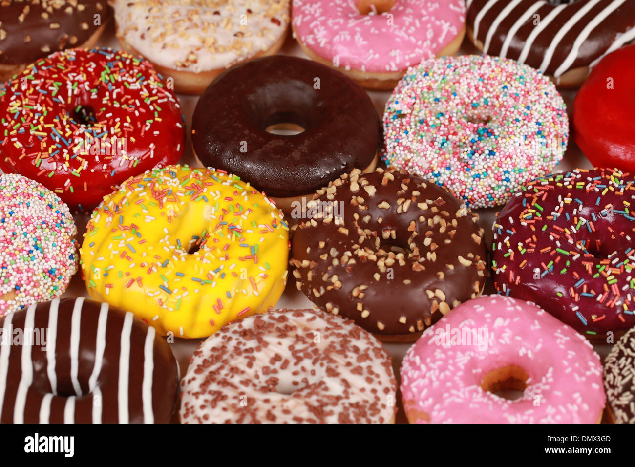 Group of many colorful donuts side by side Stock Photo - Alamy