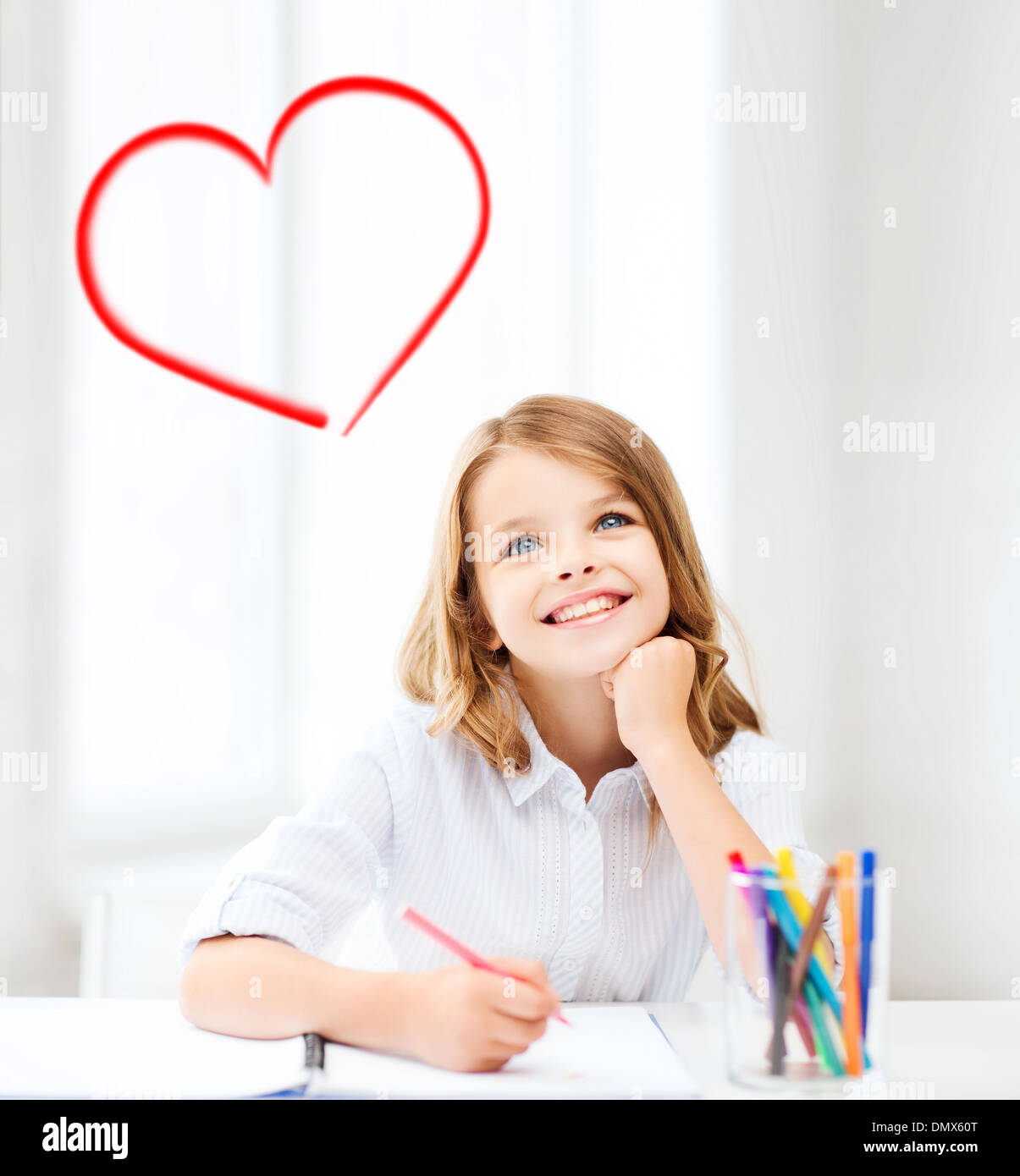 smiling little student girl drawing at school Stock Photo - Alamy