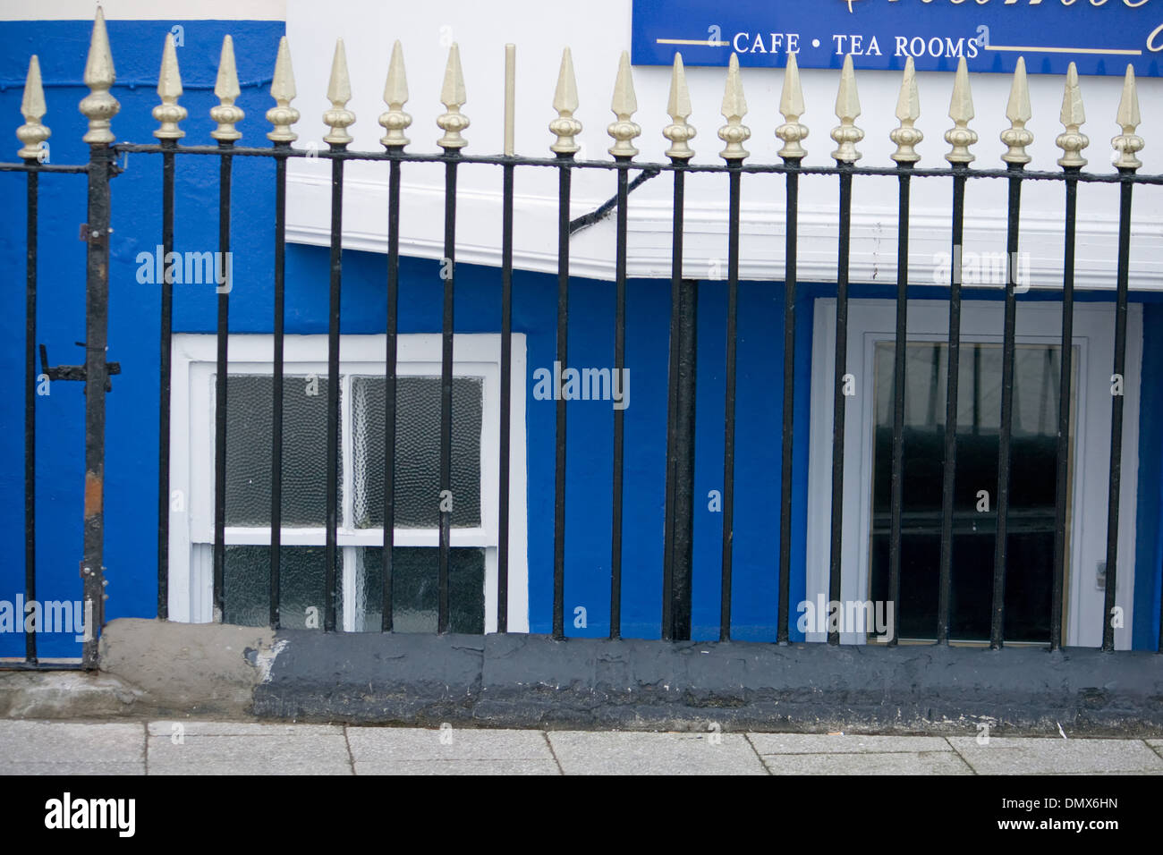 Basement level windows seen through spiked railings Stock Photo - Alamy
