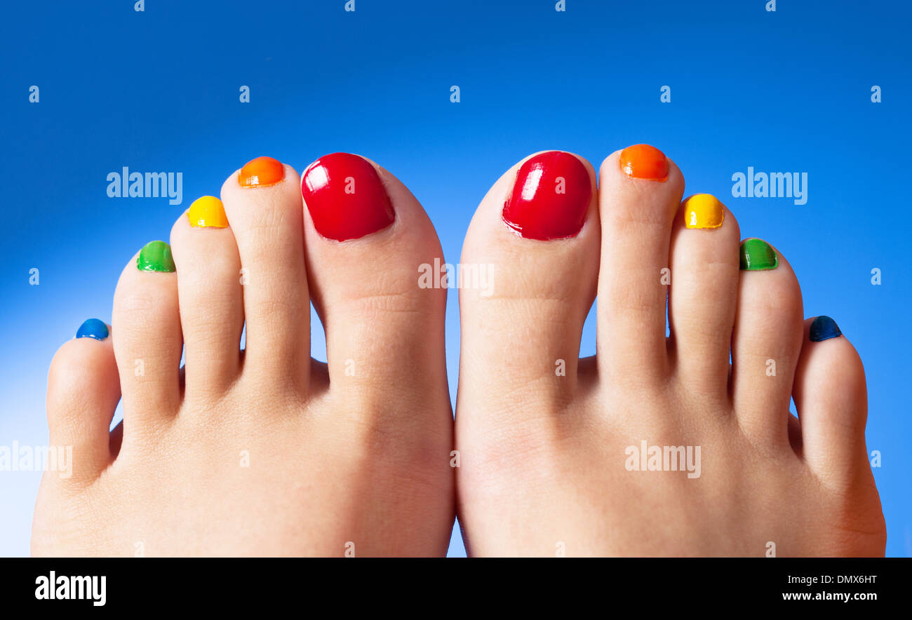 Rainbow nail polish feet art Stock Photo - Alamy