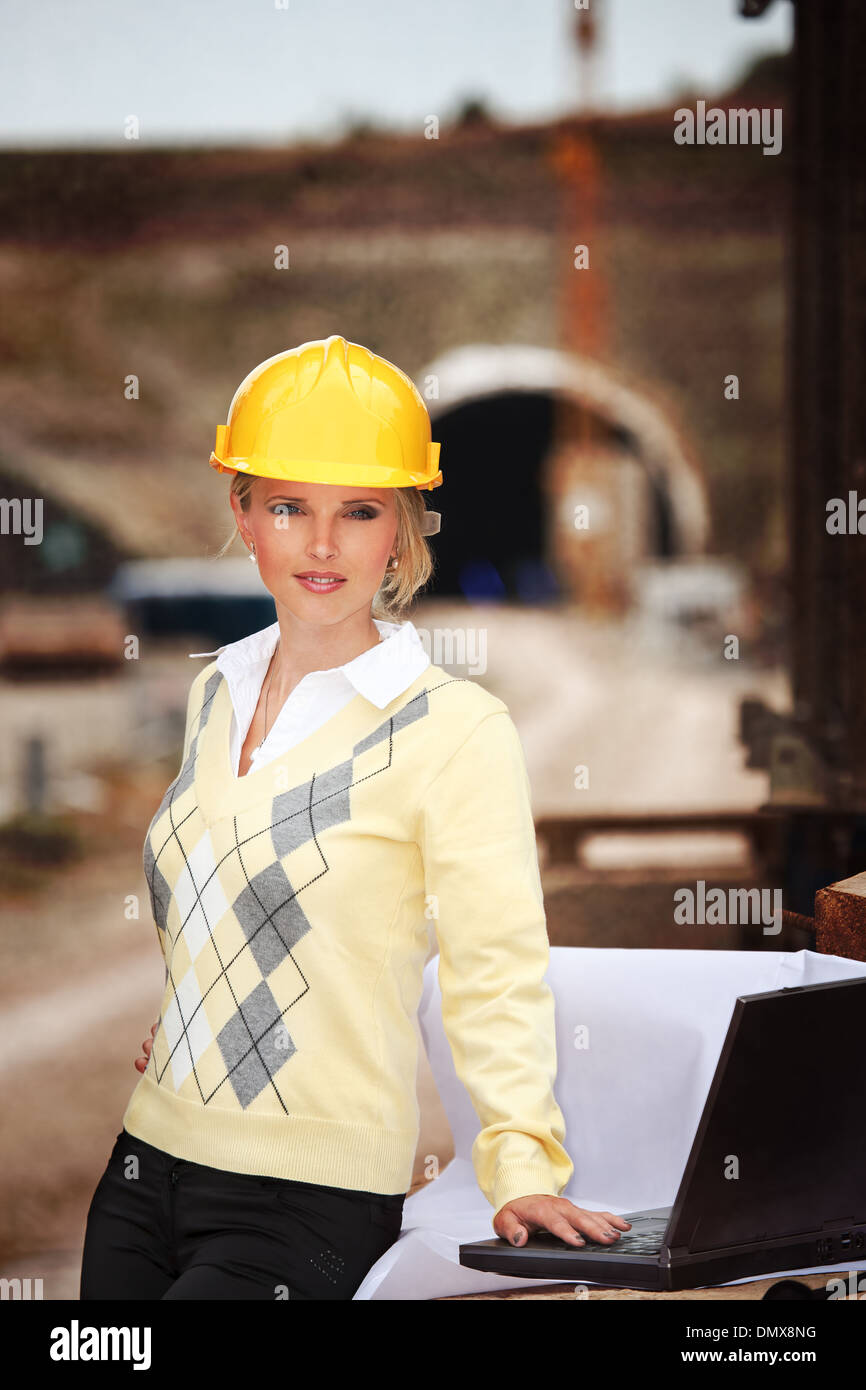 A young female constructor at building of a new motorway in Germany ...
