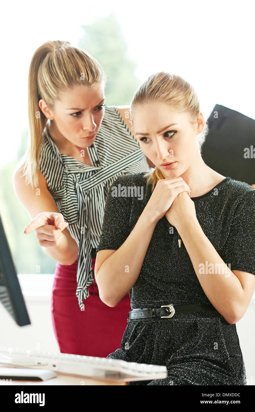 Work colleague intimidating another Stock Photo - Alamy