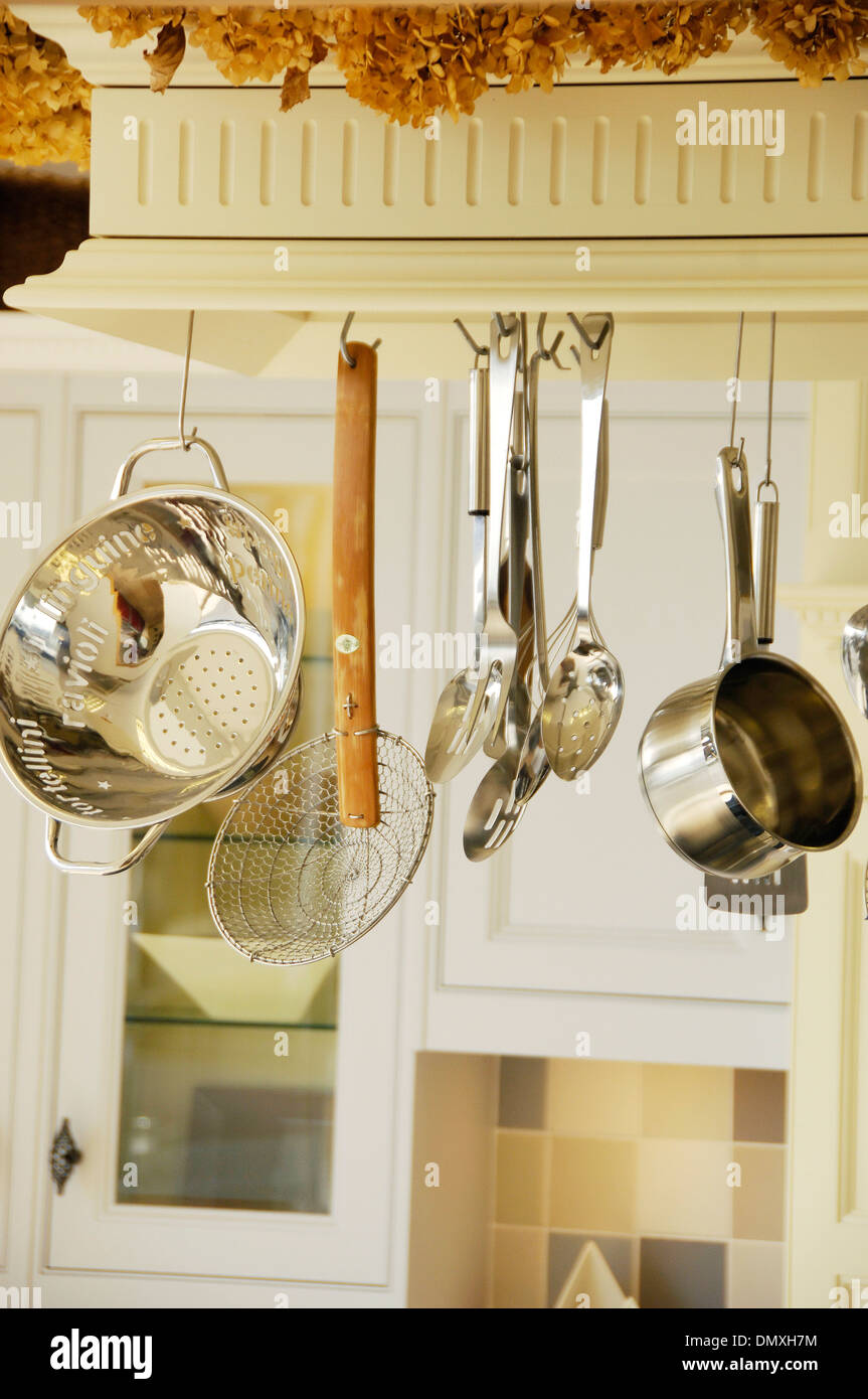 Kitchen utensils hung up in a modern kitchen Stock Photo - Alamy