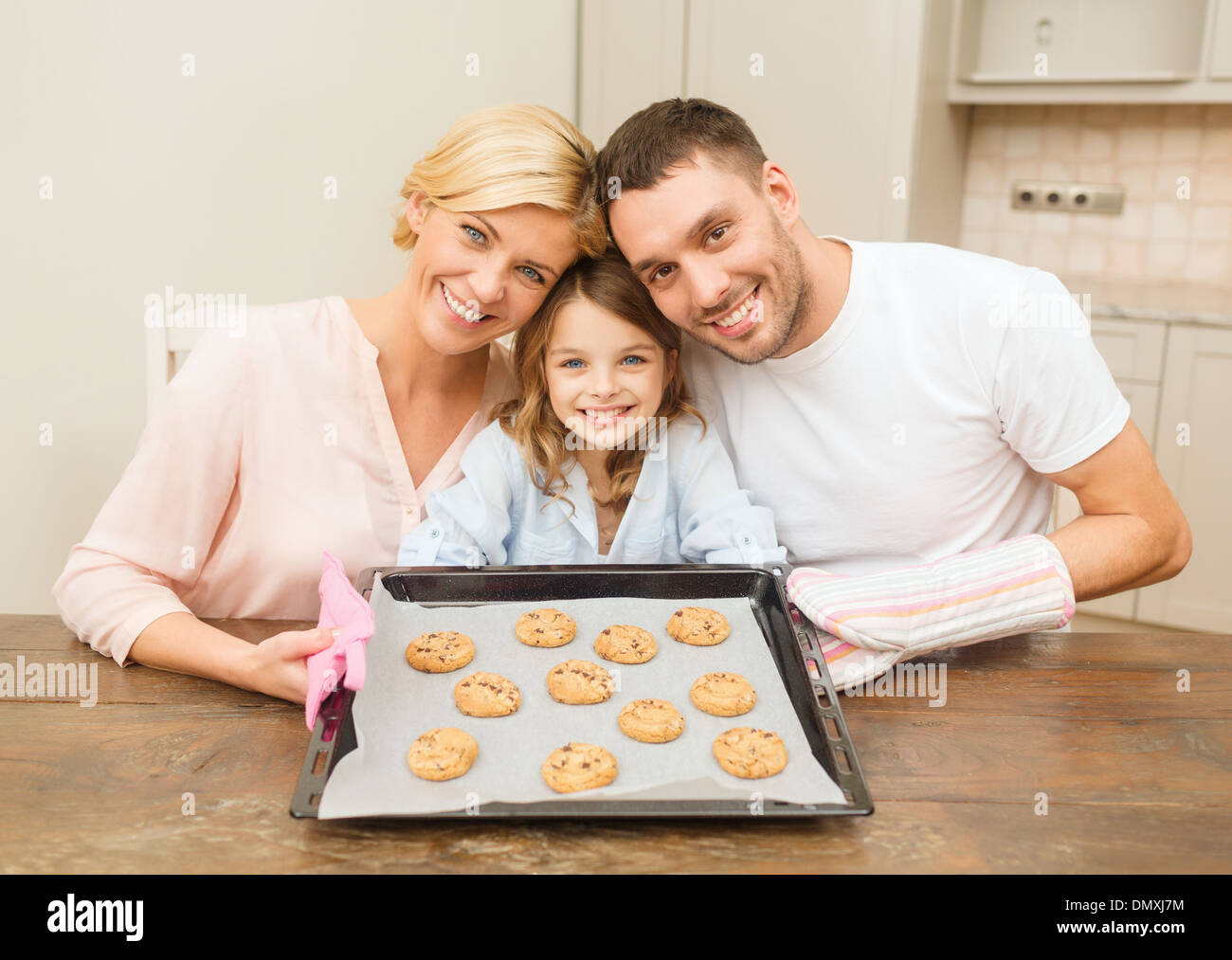 happy family making cookies at home Stock Photo - Alamy