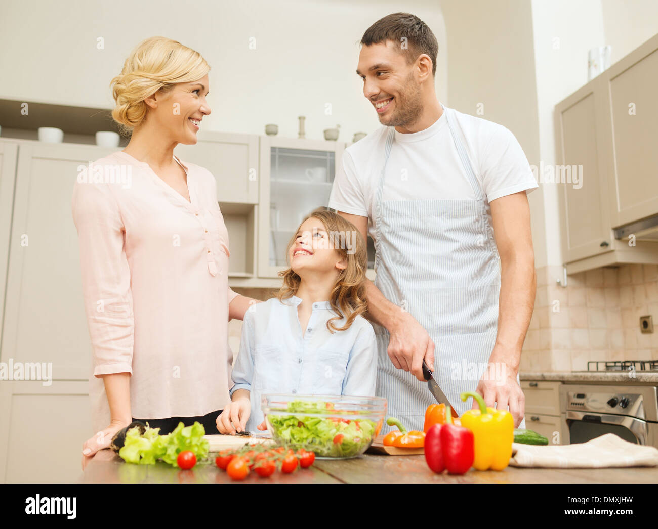 happy family making dinner in kitchen Stock Photo - Alamy