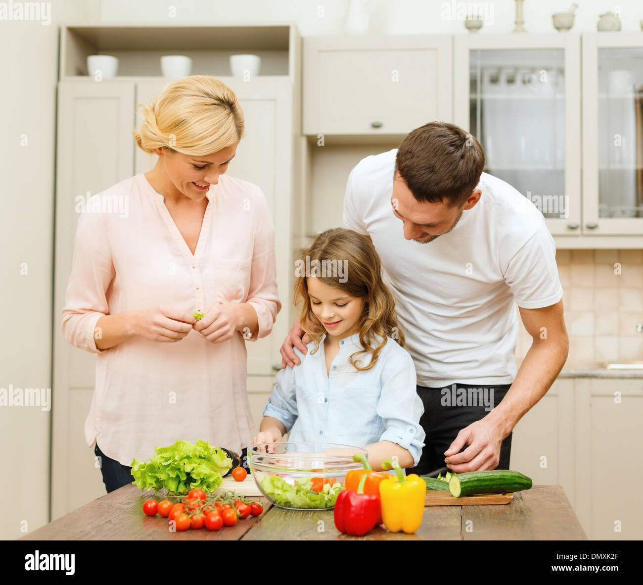 Mother girl making salad hi-res stock photography and images - Alamy