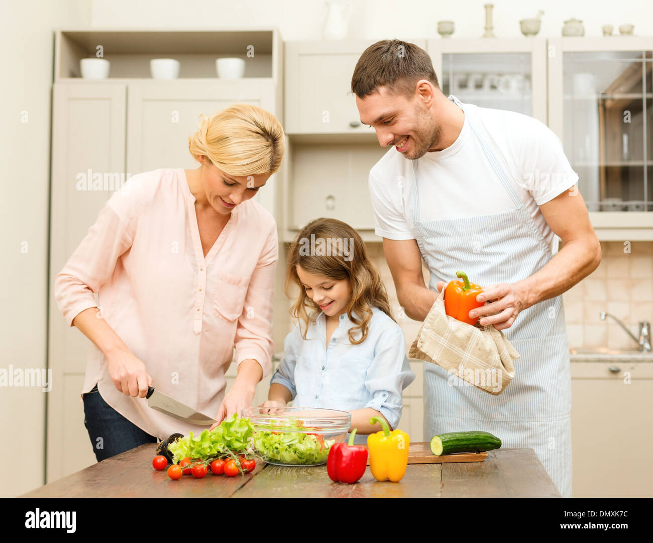 happy family making dinner in kitchen Stock Photo - Alamy