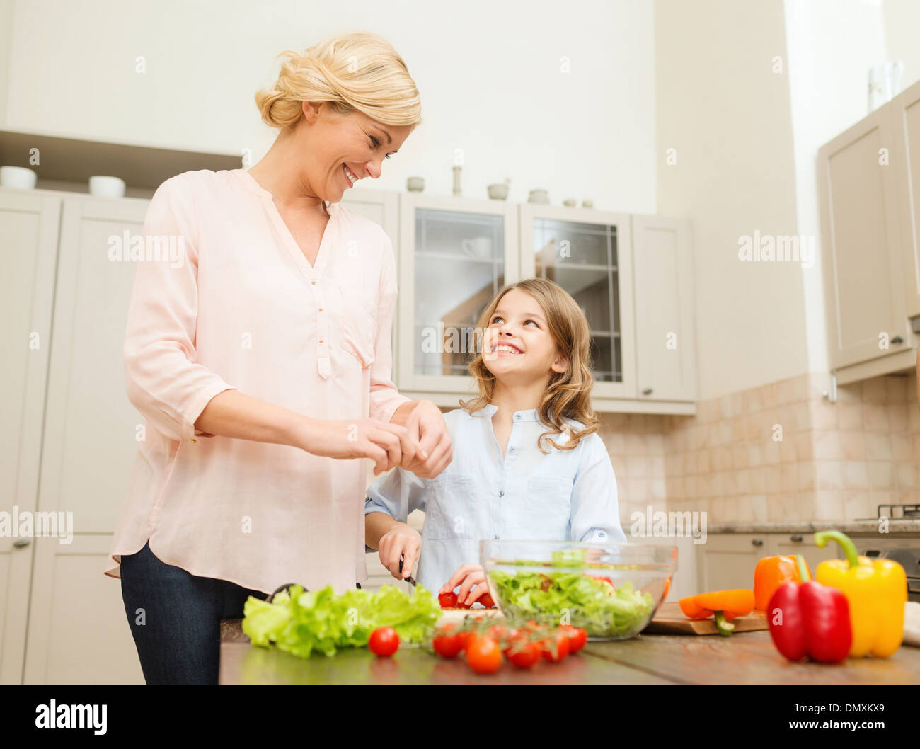 happy family making dinner in kitchen Stock Photo - Alamy