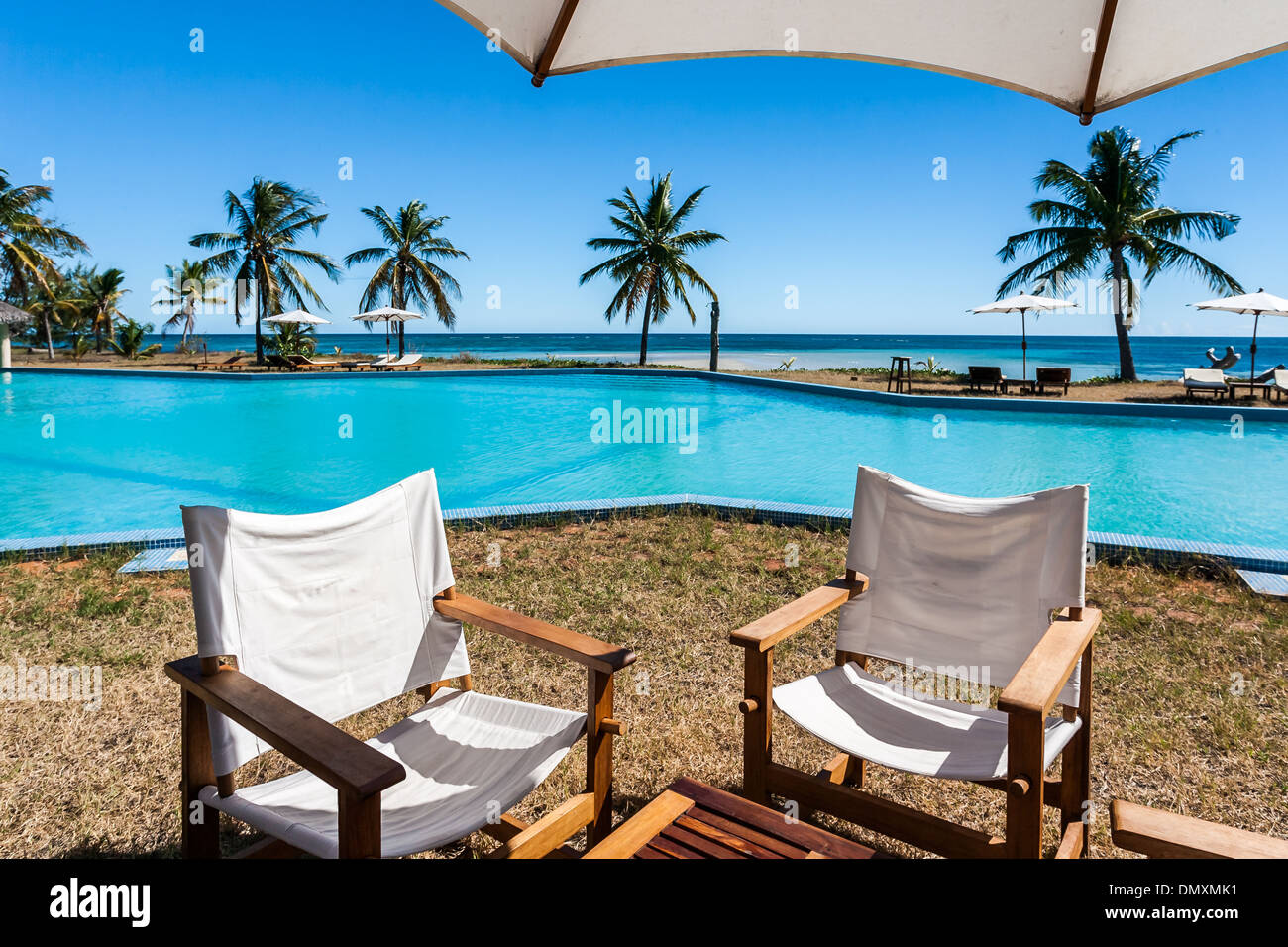 Cafe and swimming pool on the tropical beach Stock Photo - Alamy