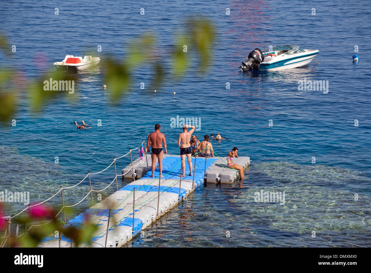 People swimming off a jetty in the Red Sea Egypt Stock Photo - Alamy