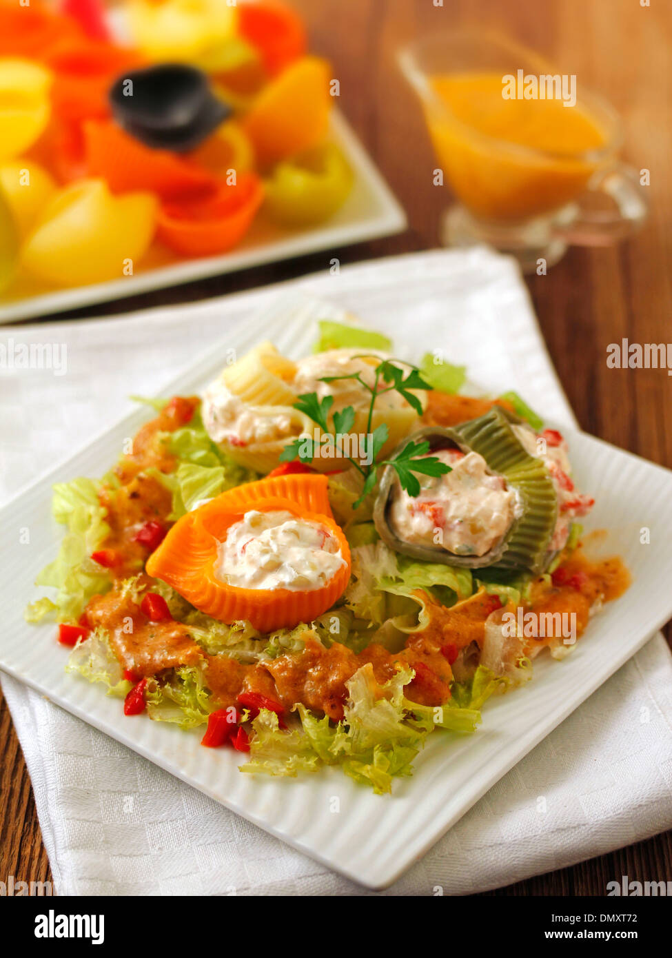 Stuffed pipe rigate with salad. Recipe available Stock Photo - Alamy