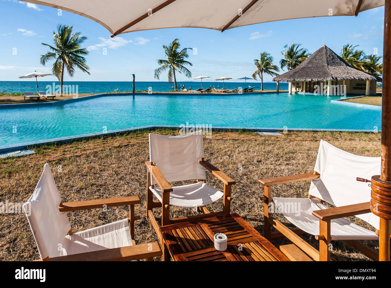 Cafe and swimming pool on the tropical beach Stock Photo - Alamy