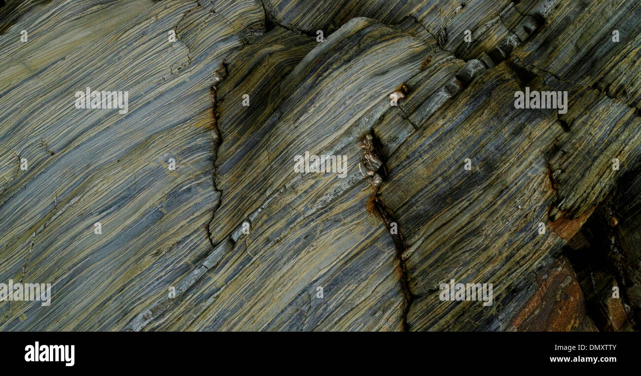 abstract patterns of compression in rock at St David's Head in Wales ...