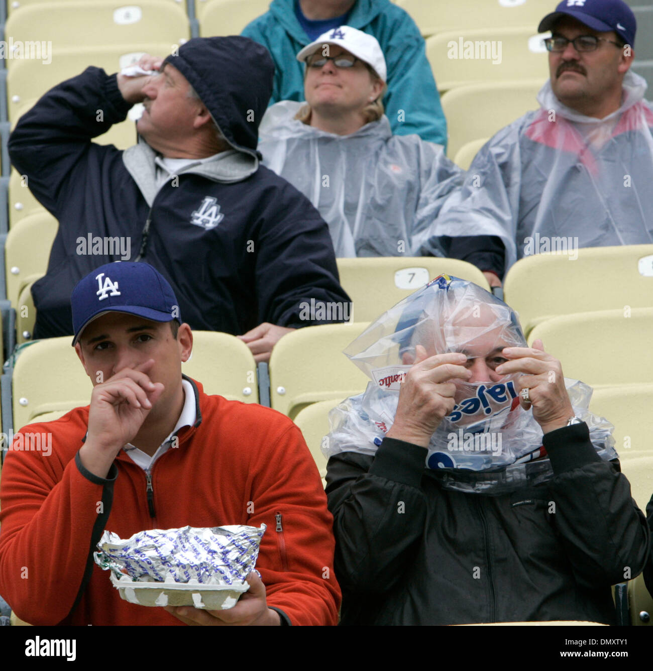 Apr 03, 2006; Los Angeles, CA, USA; Fans wait in the rain at Dodgers ...