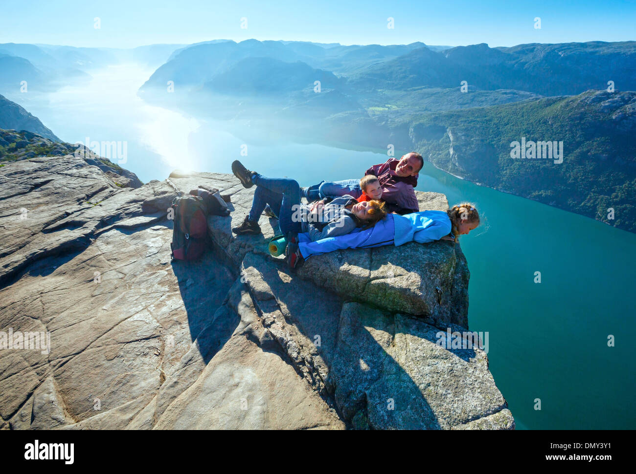 Happy family on top of Preikestolen massive cliff (Norway, Lysefjorden ...