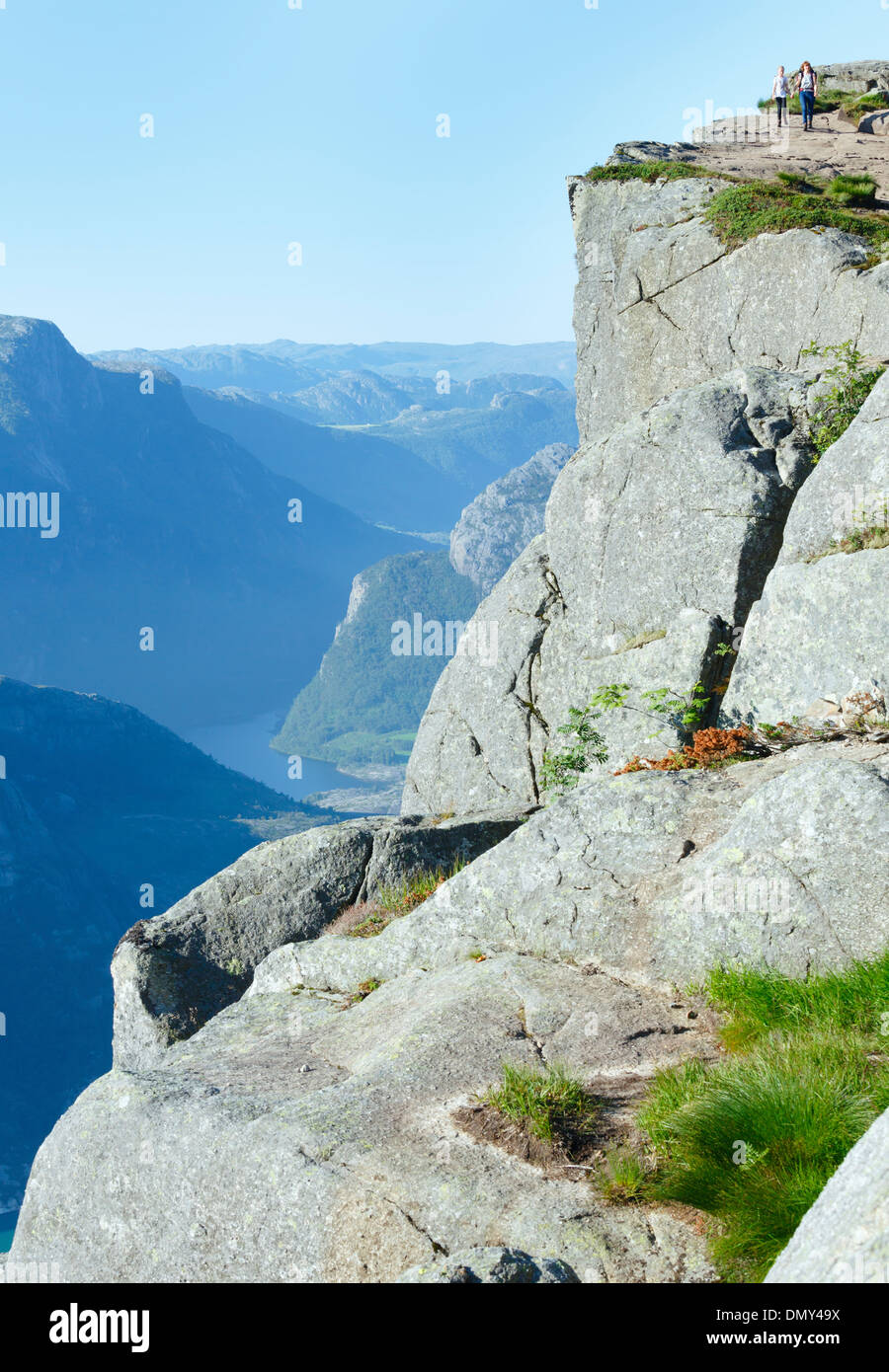 Family on Preikestolen massive cliff (Norway, Lysefjorden summer view ...