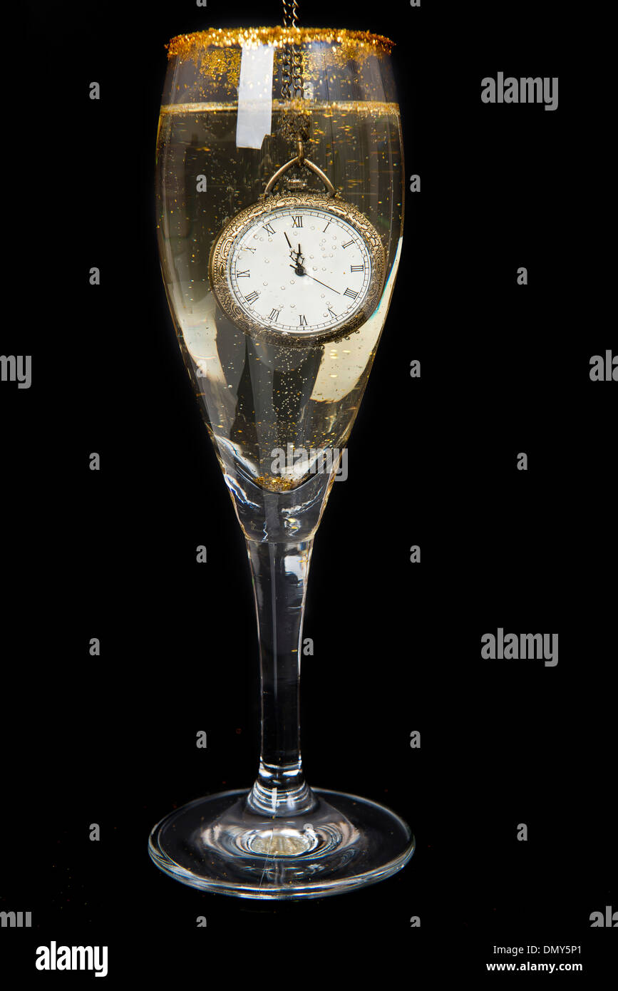 a glass of champagne and watch inside Stock Photo - Alamy