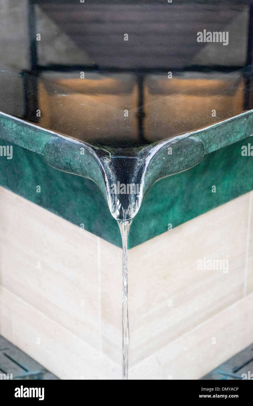 Water trickling from a spout Stock Photo - Alamy