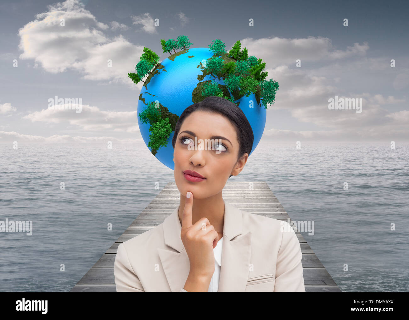 Composite image of smiling businesswoman thinking Stock Photo - Alamy
