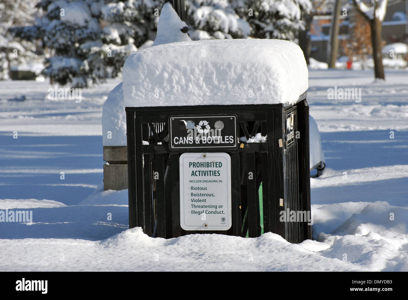 A recycling bin covered in snow in a Canadian park Stock Photo - Alamy