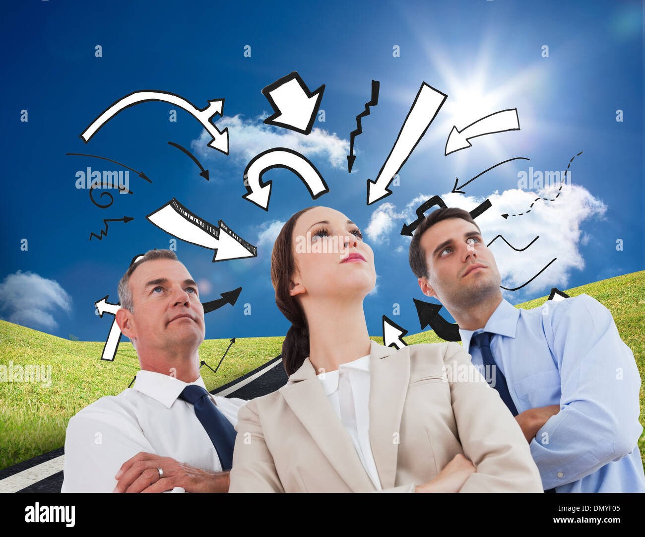 Composite image of serious work team posing together looking away Stock ...