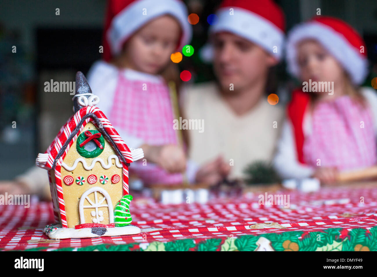 Gingerbread fairy house decorated by colorful candies on a background ...