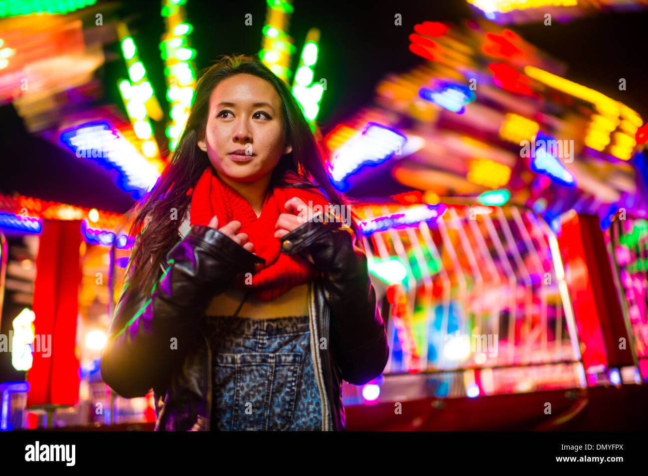 A Teenage girl young Chinese woman enjoying herself at the funfair ...