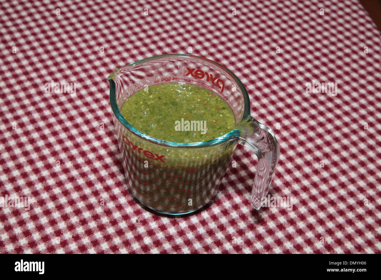 Salsa Verde in a Pyrek measuring cup Stock Photo - Alamy