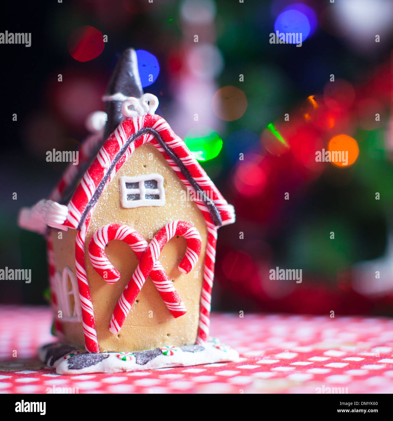 Close-up Gingerbread fairy house decorated by colorful candies on a ...
