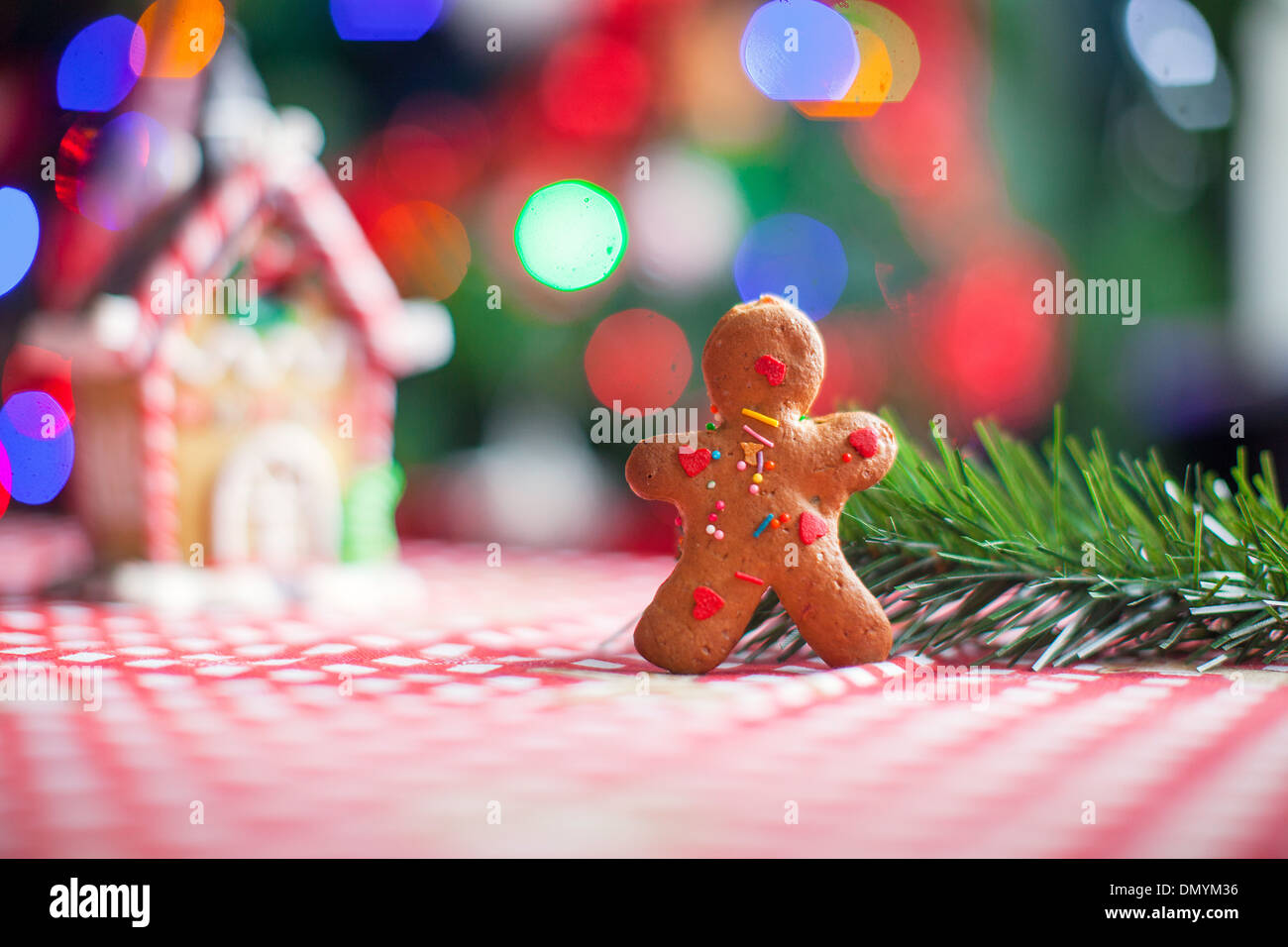 Gingerbread man background candy ginger house and Christmas tree lights ...