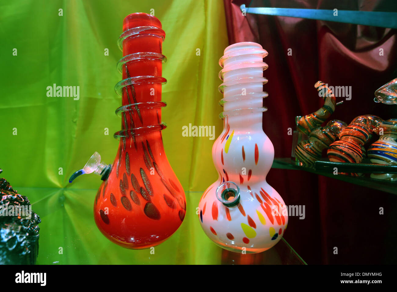 Two colorful glass hookah water pipes on display at a smoke shop Stock ...