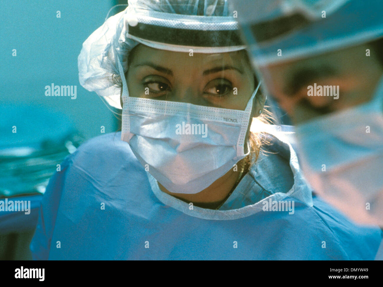 Surgical team in the OR at a major New York Hospital doing a delicate ...